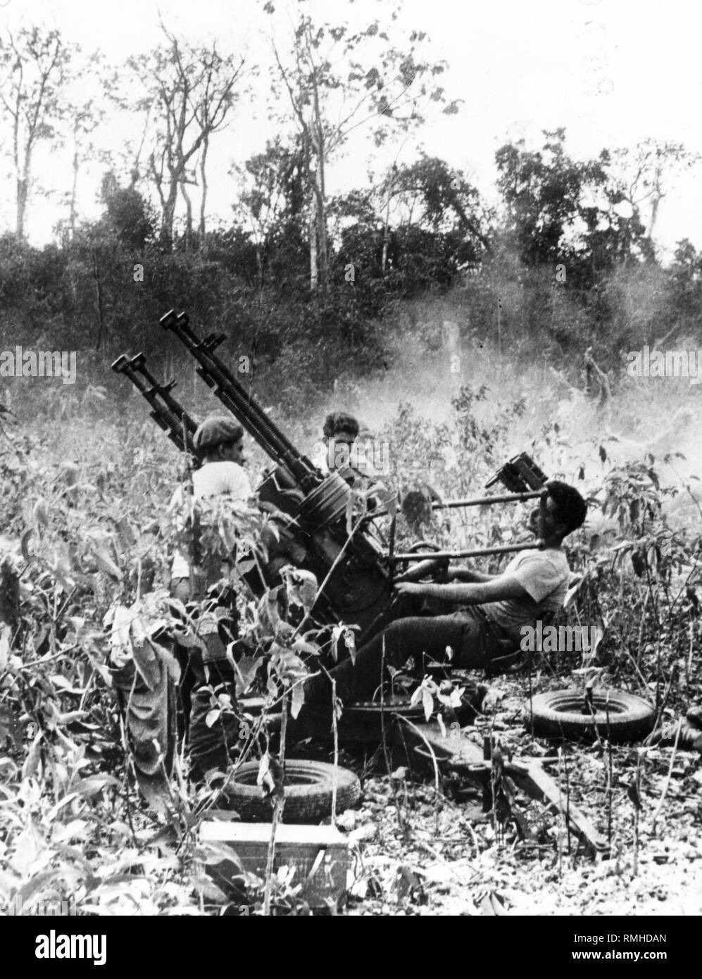 Cuban students, members of the militia, are in action on a four ...
