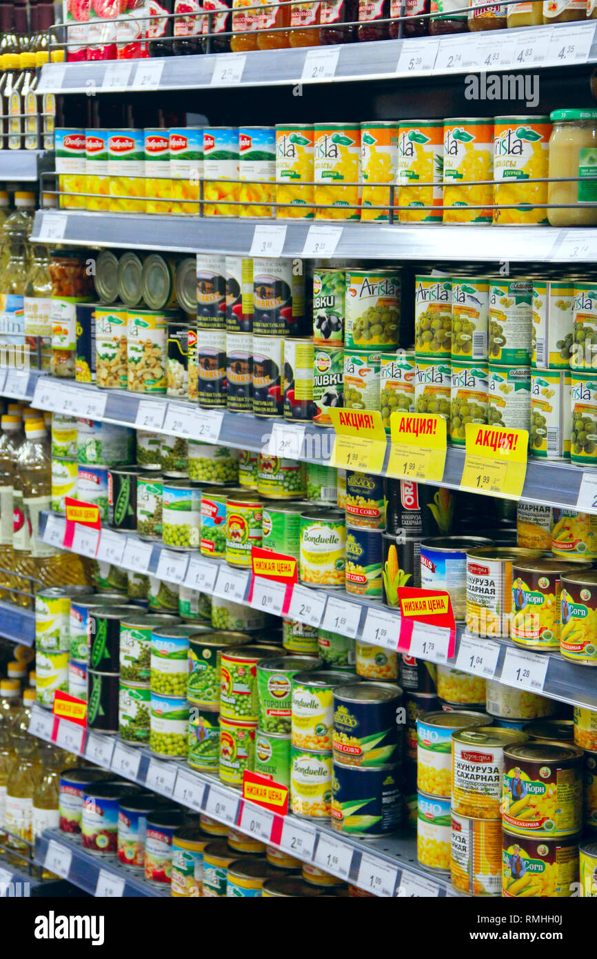 Store canned in shop. Canned food on supermarket shelves pineapples ...