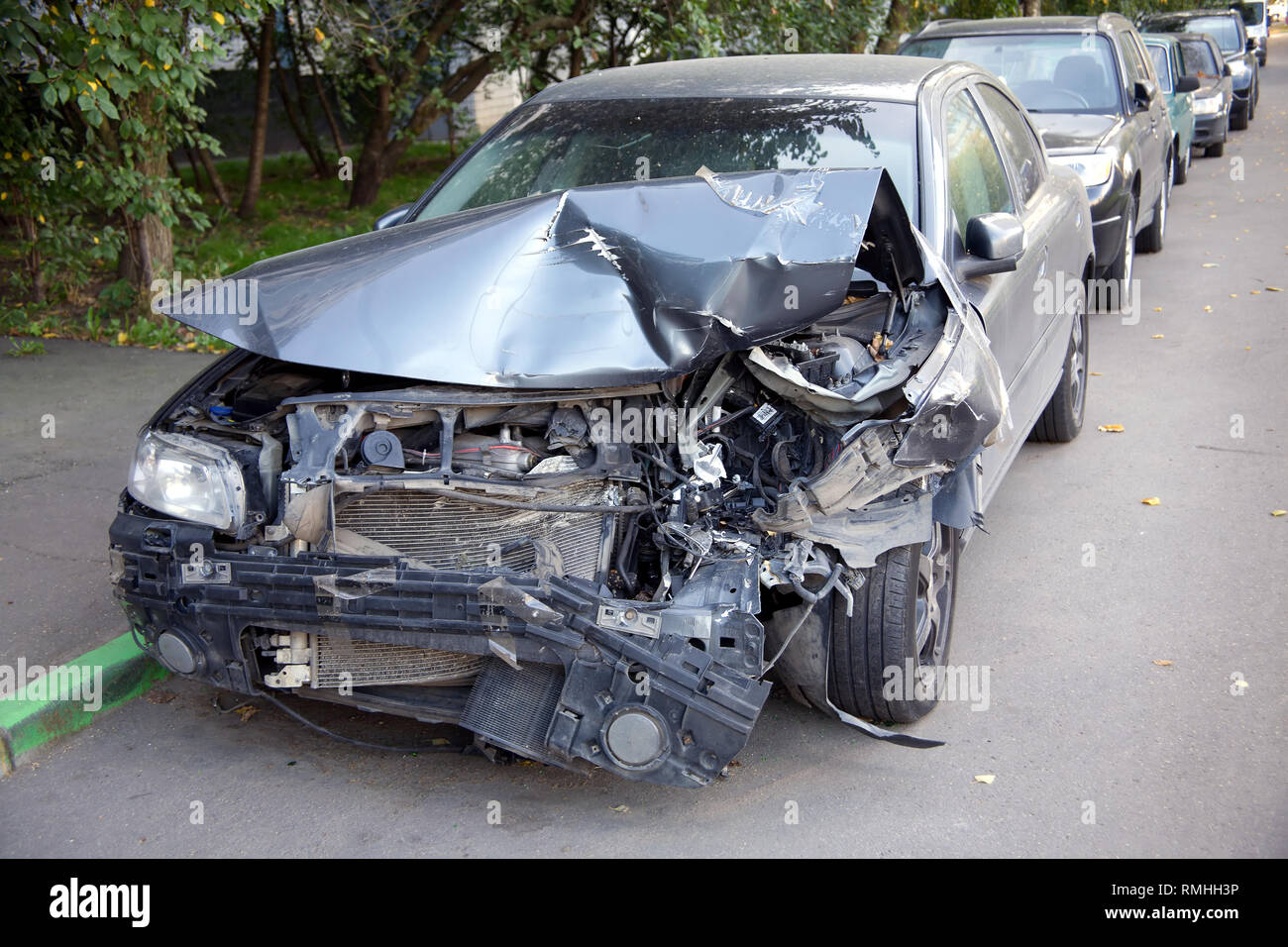 Passenger car with broken hood and motor section stay is among other ...