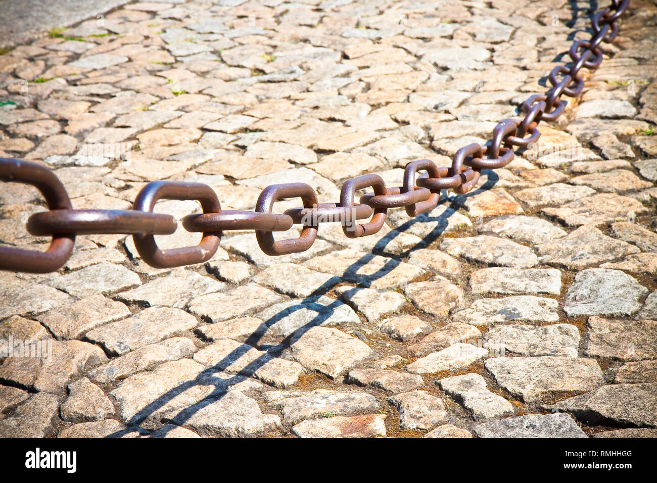 Metal chain that marks the city pedestrian area Stock Photo - Alamy