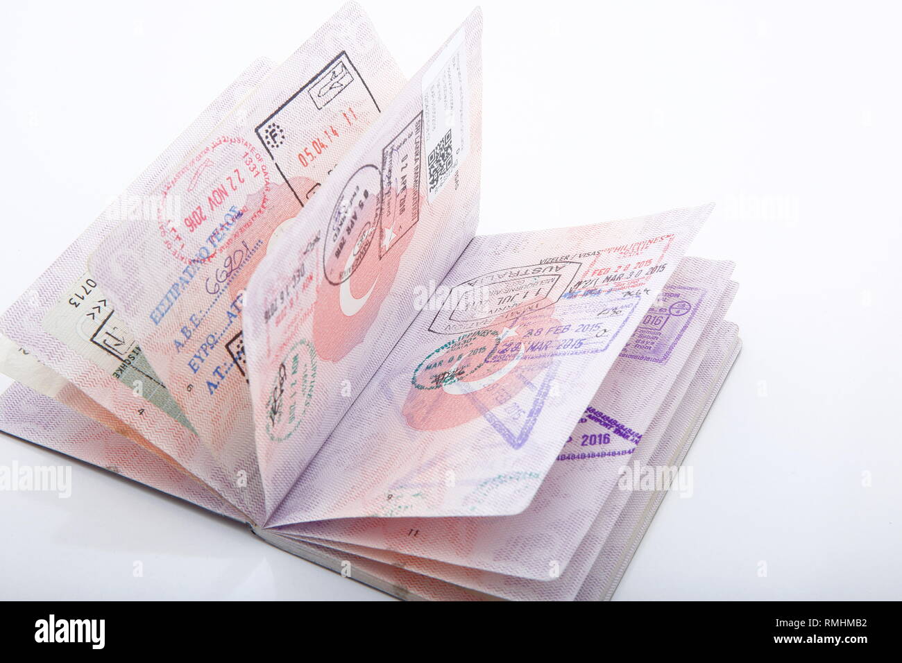 On the pages, a passport view with various country entry visas Stock ...