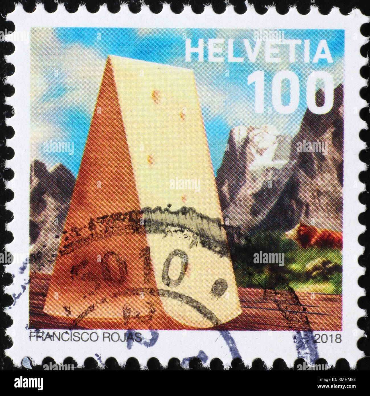 Swiss cheese on postage stamp Stock Photo - Alamy