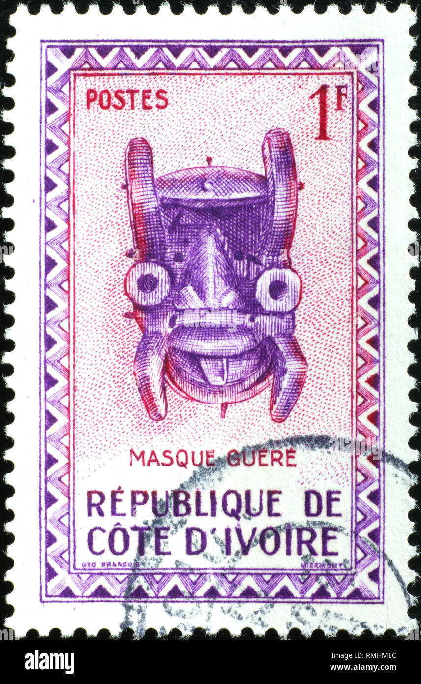 Wooden mask on postage stamp of Ivory Coast Stock Photo - Alamy