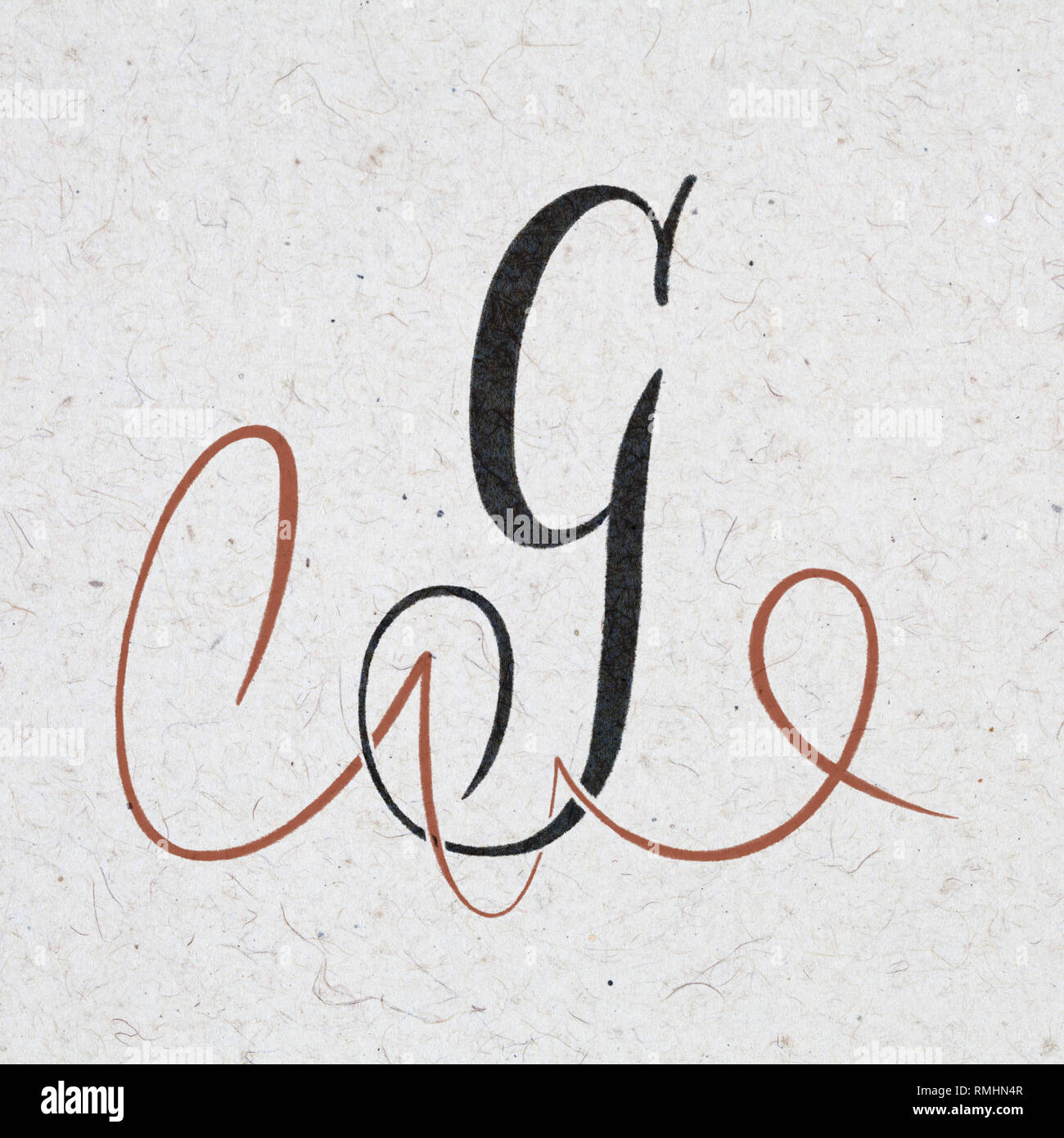 Calligraphic letter G with flourishes on kraft paper Stock Photo - Alamy
