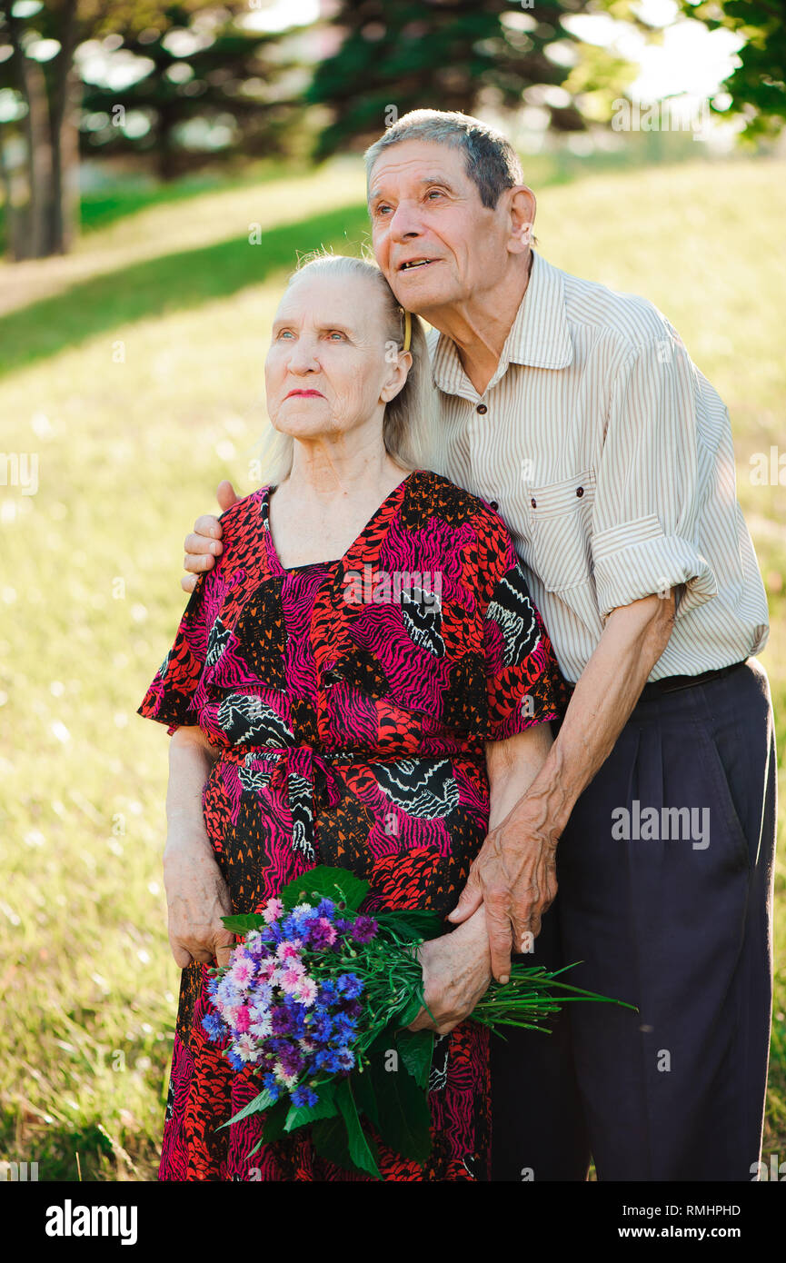 Happy elderly couple at nature. Happy old people Stock Photo - Alamy