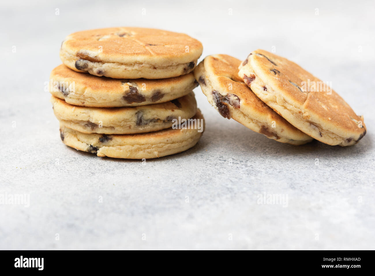 Stack of welsh cakes on off white and grey background, selective focus ...