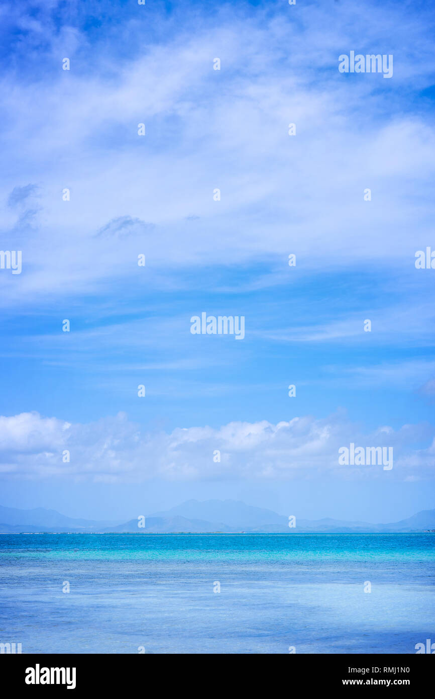 Beautiful ocean scene view isolated with light blue sky background ...