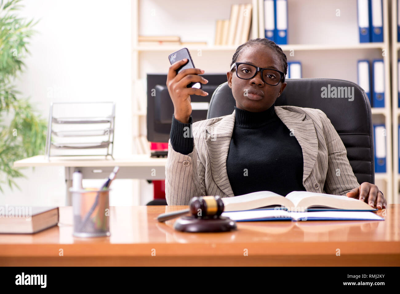 Black female lawyer in courthouse Stock Photo - Alamy