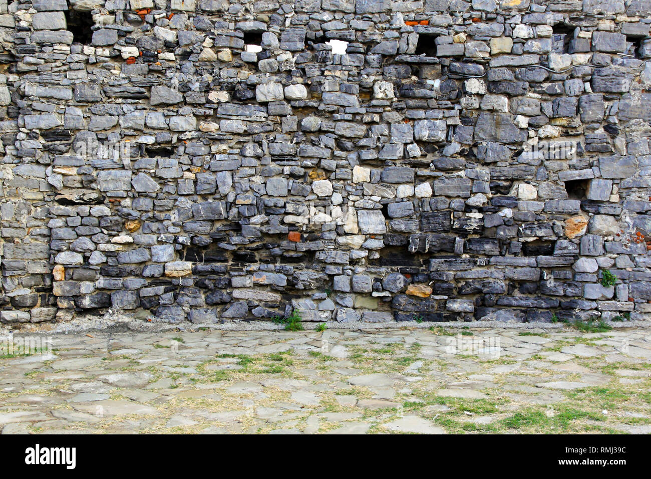 Medieval stone wall at Portovenere church exterior Stock Photo - Alamy