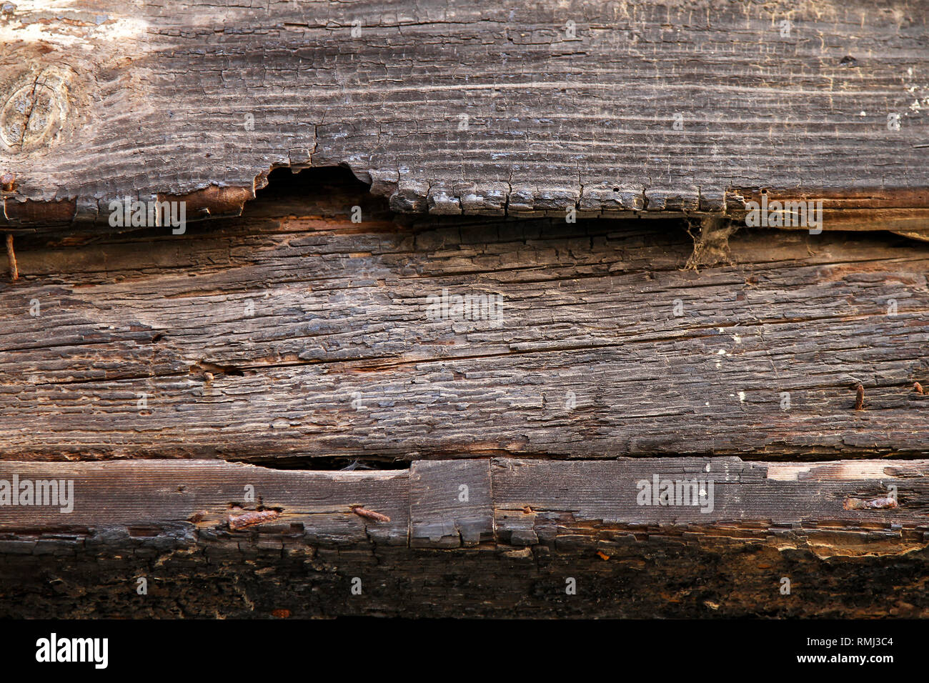 Damaged and burned wood beam after fire inferno Stock Photo - Alamy