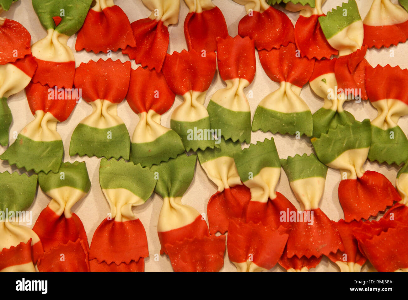 Traditional small farfalle pasta with Italian flag Stock Photo - Alamy