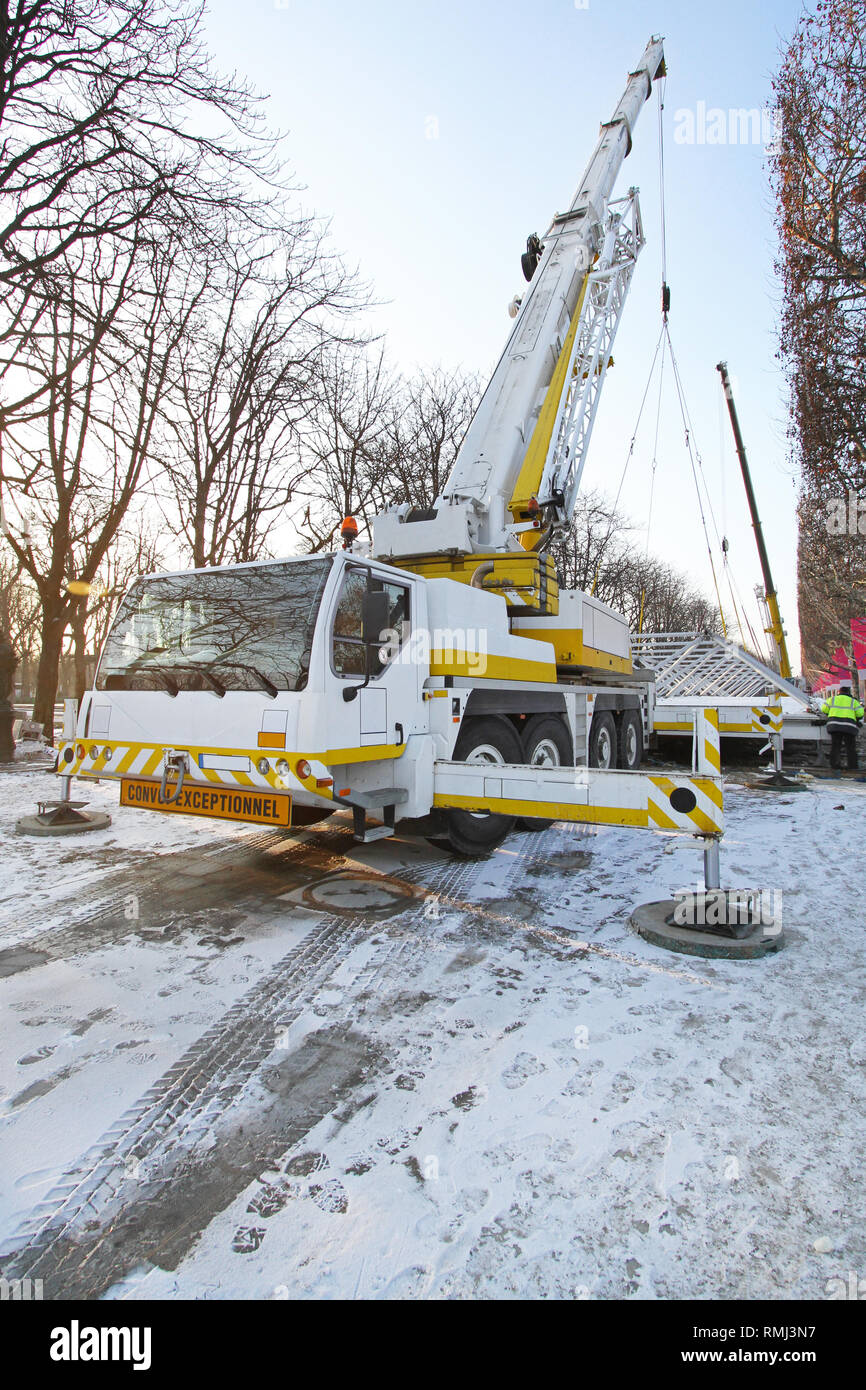 Mobile crane truck lifting structure at construction site Stock Photo ...