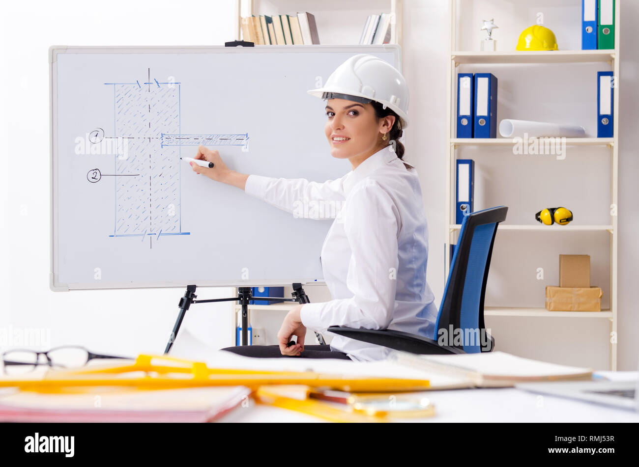 Female architect working in the office Stock Photo - Alamy