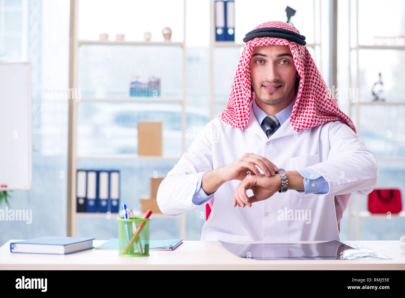 Arab doctor working in the clinic Stock Photo - Alamy