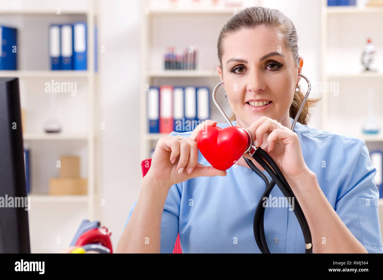 Female doctor cardiologist working in the clinic Stock Photo - Alamy