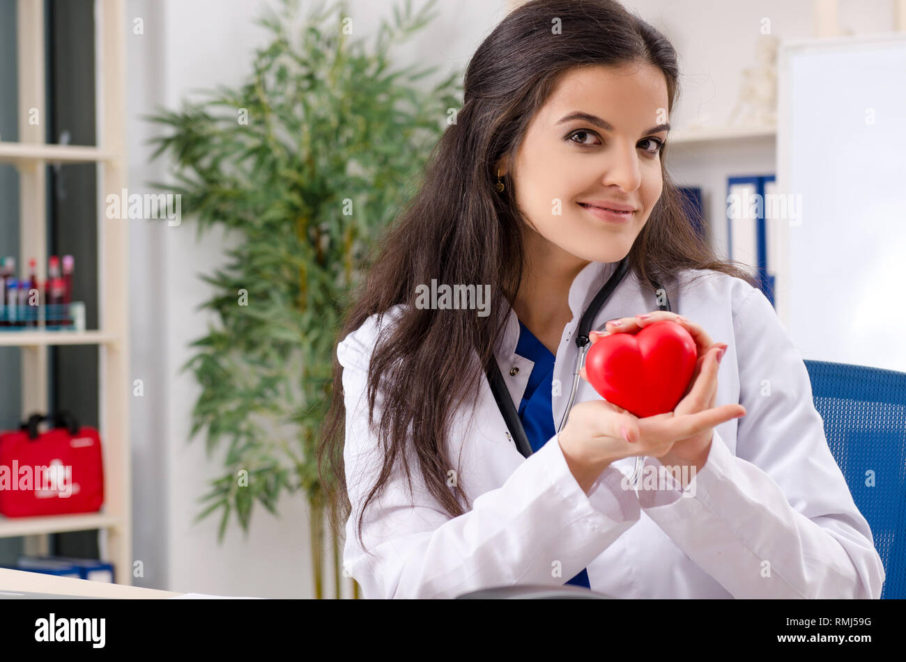 Female doctor cardiologist working in the clinic Stock Photo - Alamy