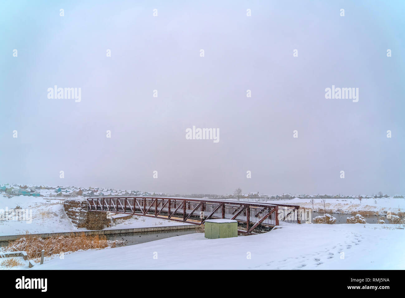 Bridge over lake against a frosty winter landscape Stock Photo - Alamy