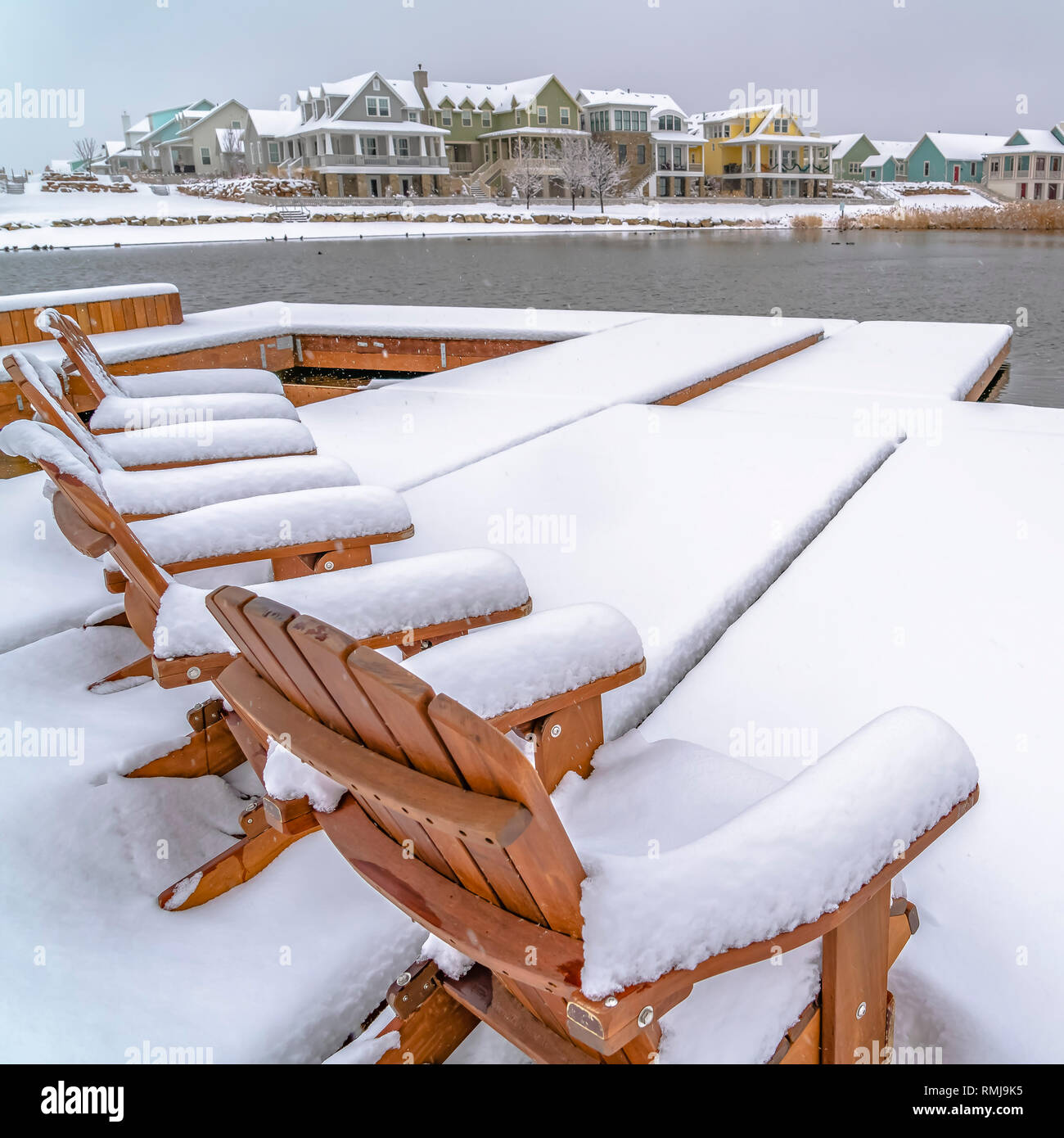 Winter in Daybreak Utah with chairs on a lake deck Stock Photo - Alamy