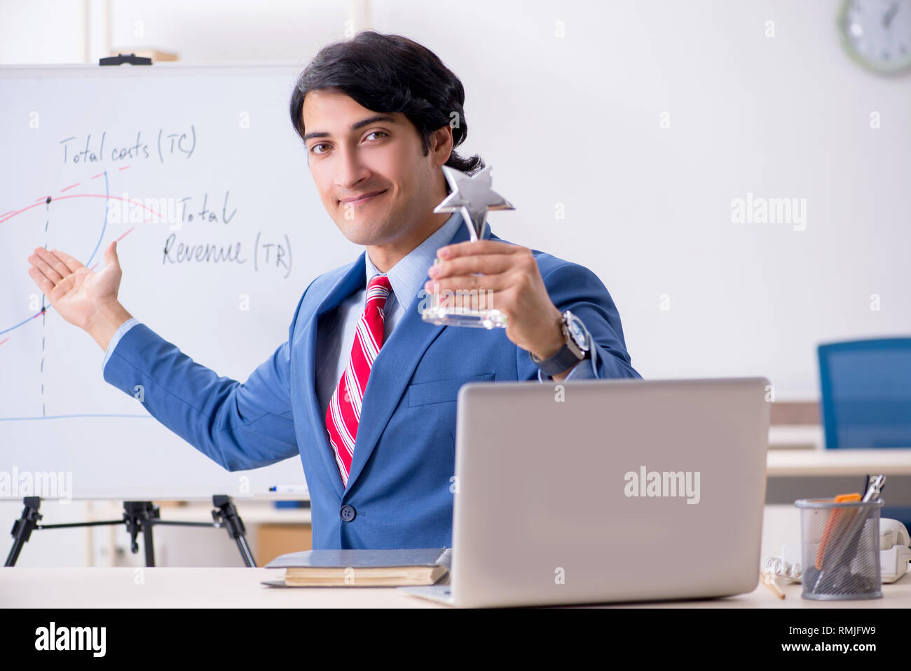Busy businessman explaining business charts Stock Photo - Alamy