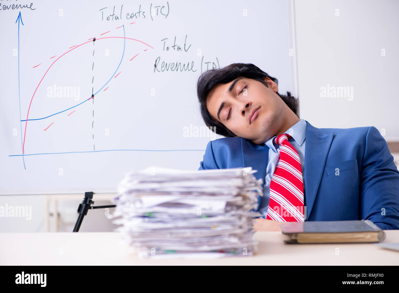 Busy businessman explaining business charts Stock Photo - Alamy