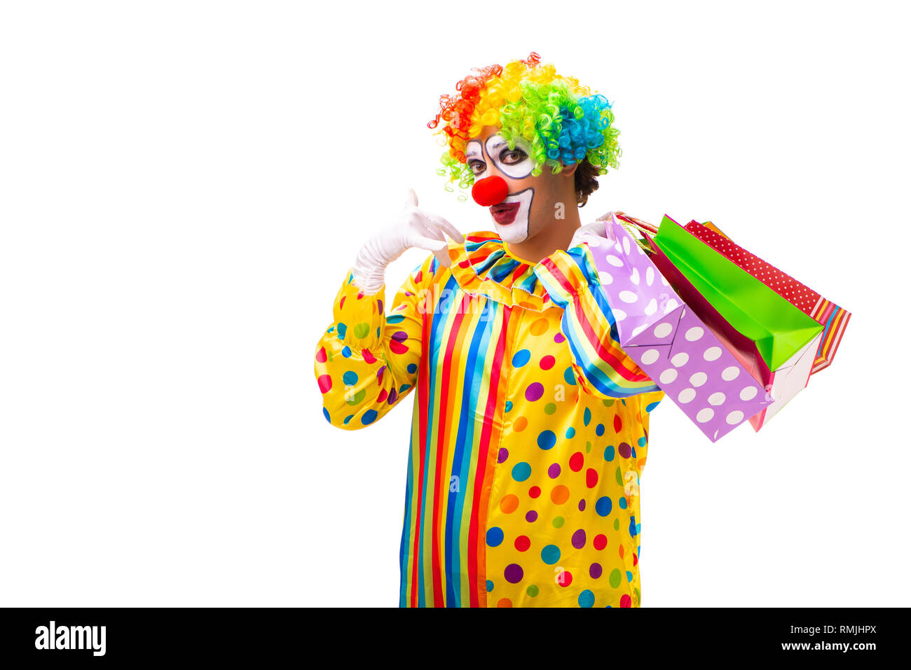 Happy male clown holding present hi-res stock photography and images ...