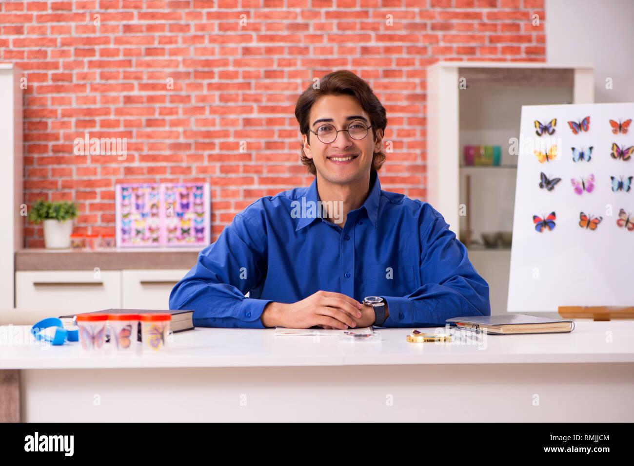 Student entomologist studying new species of butterflies Stock Photo ...