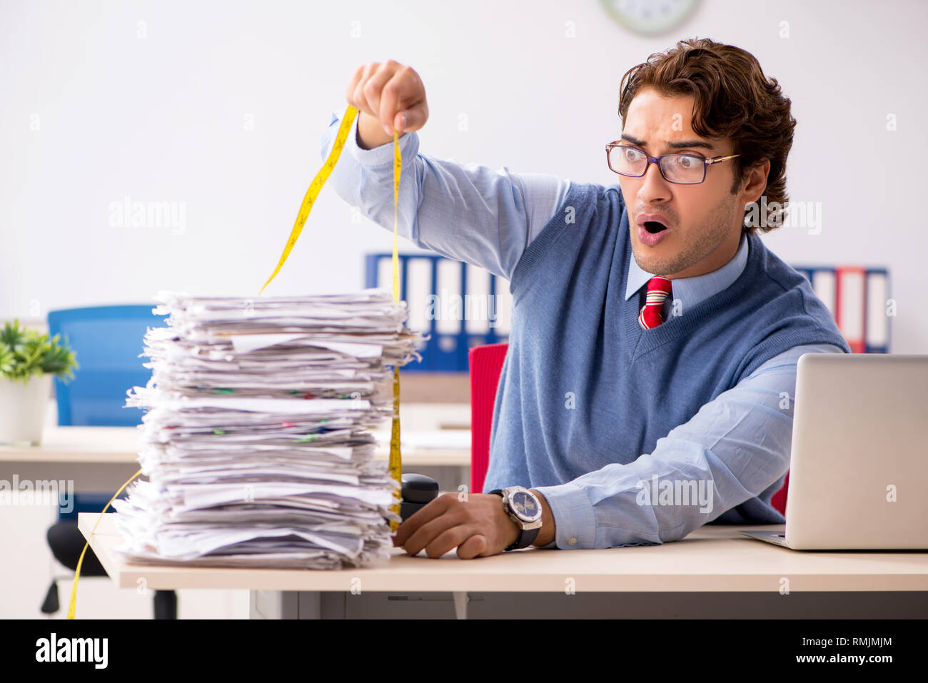 Shocked young man measuring hi-res stock photography and images - Alamy