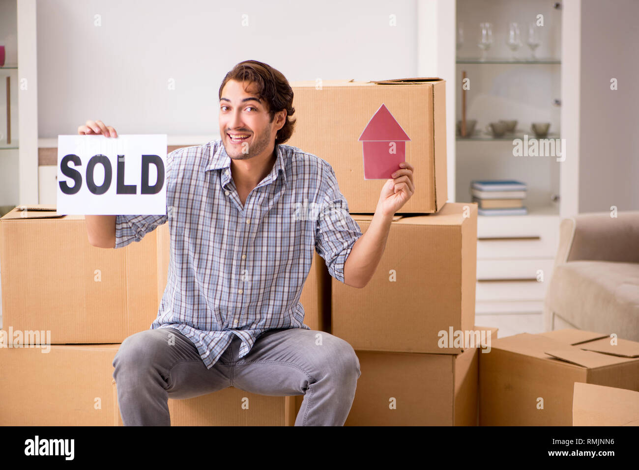 Young man selling his house Stock Photo - Alamy