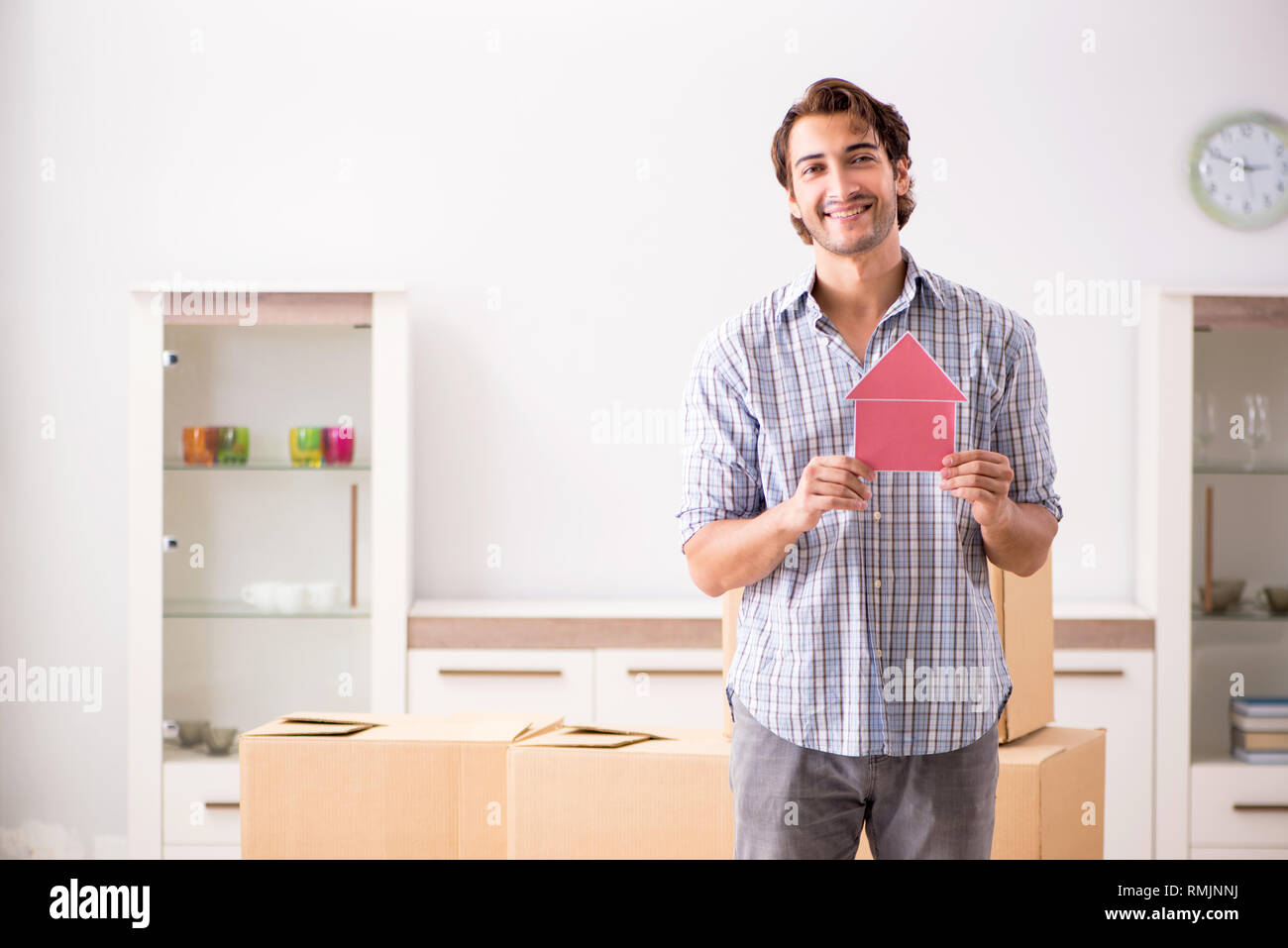 Young man offering home for sale and moving out Stock Photo - Alamy