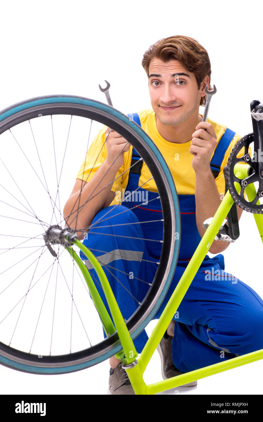 Man repairing his bike isolated on white background Stock Photo - Alamy