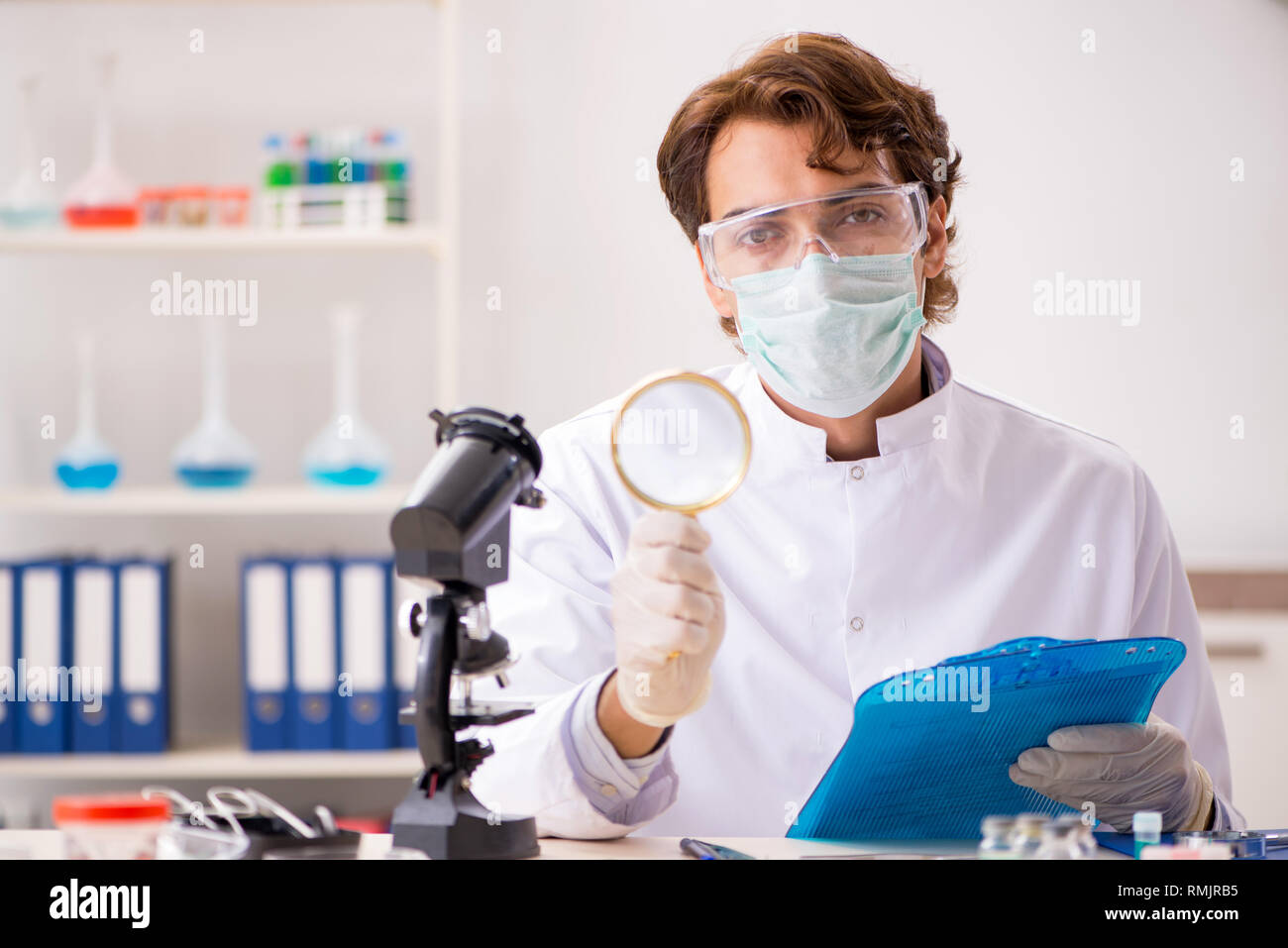 Male entomologist working in the lab on new species Stock Photo - Alamy