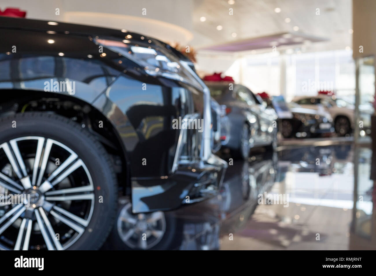 Car auto dealership. Themed blur background with bokeh effect. New cars ...