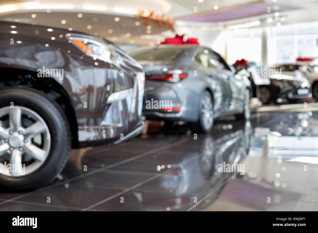 New cars at dealer showroom. For use as a background. Modern and ...
