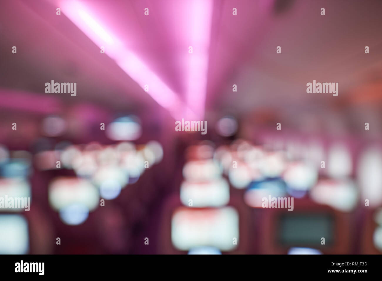 Defocused shot of lower deck in modern double-deck, wide-body, four ...