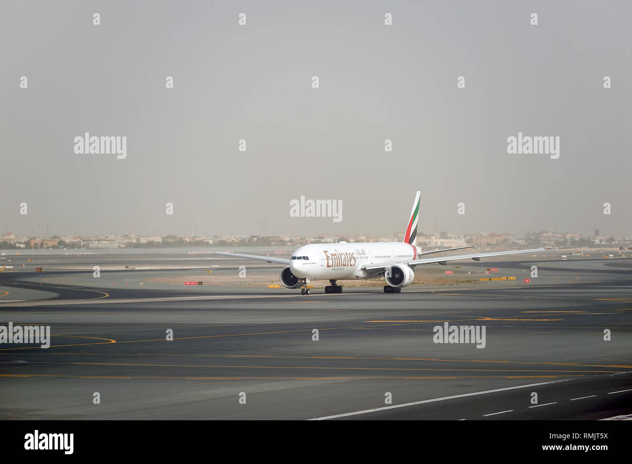 DUBAI, UAE - MARCH 10, 2015: Emirates Boeing 777 at Dubai International ...