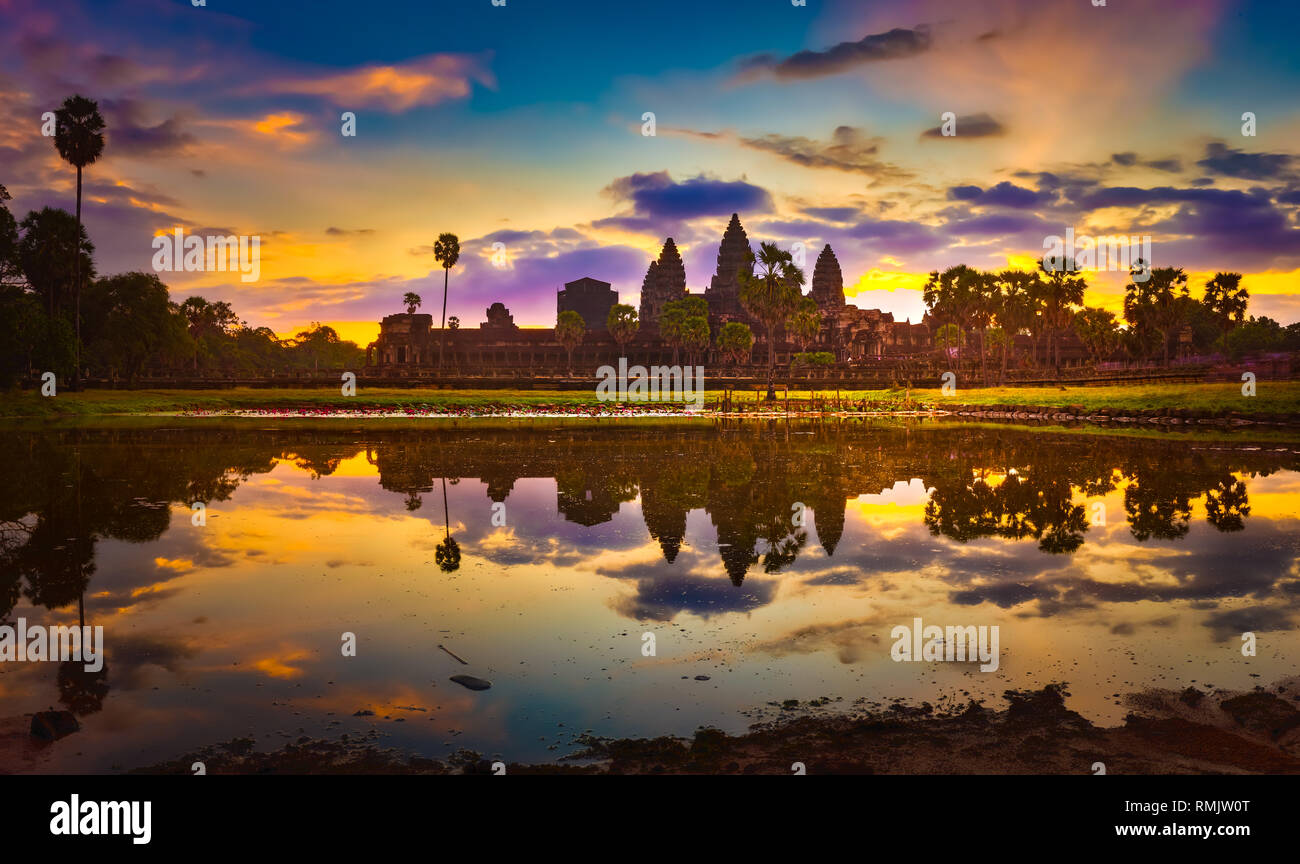 Angkor Wat temple reflecting in water of Lotus pond at sunrise. Siem ...