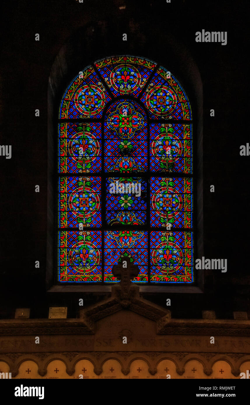 Paris, France - January 22, 2015: Ornate stained glass windows in one ...