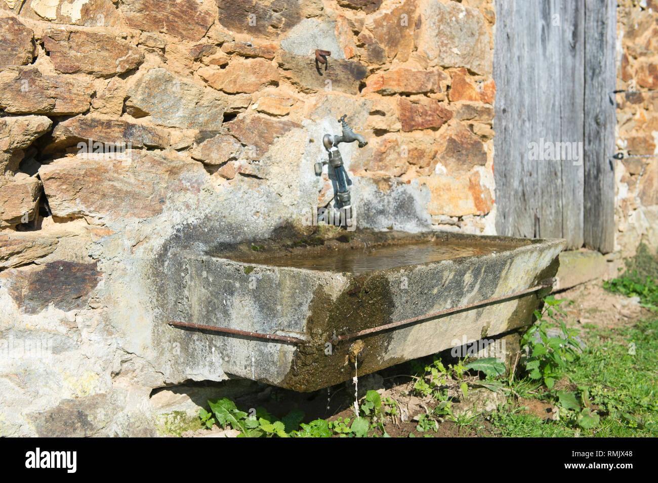 Old copper water tap at French wall Stock Photo - Alamy