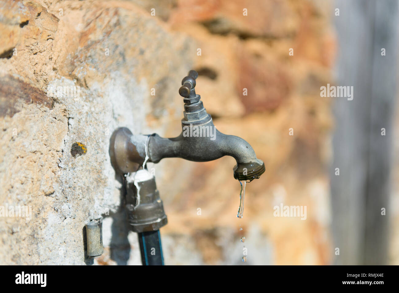 Old copper water tap at French wall Stock Photo - Alamy