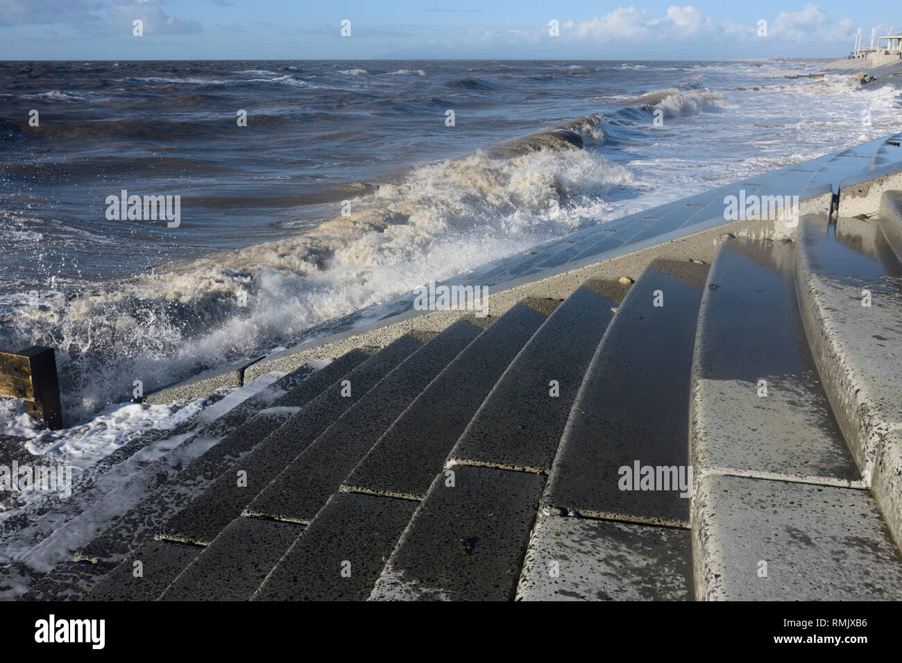 Waves from rough sea breaking on concrete stepped revetmet, protecting ...