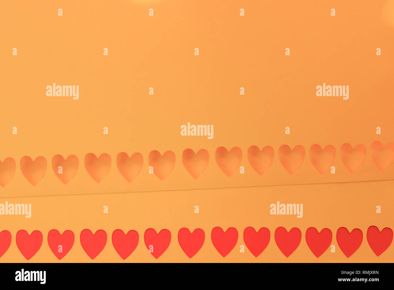 Colorful background with cutout hearts Stock Photo - Alamy