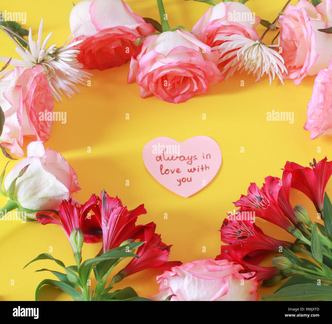 Flower arrangement with cute writing on a heart Stock Photo - Alamy