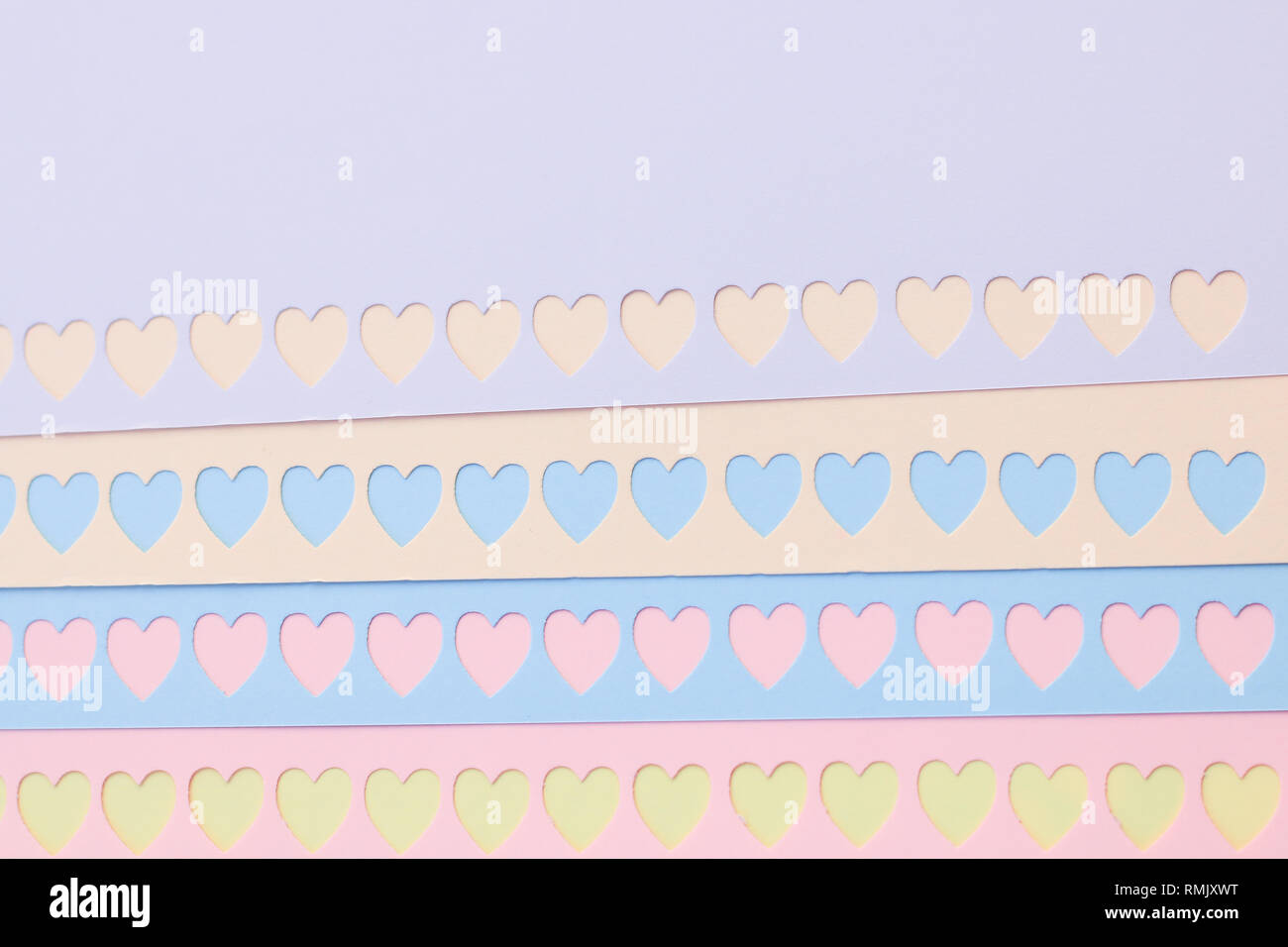 Colorful background with cutout hearts Stock Photo - Alamy