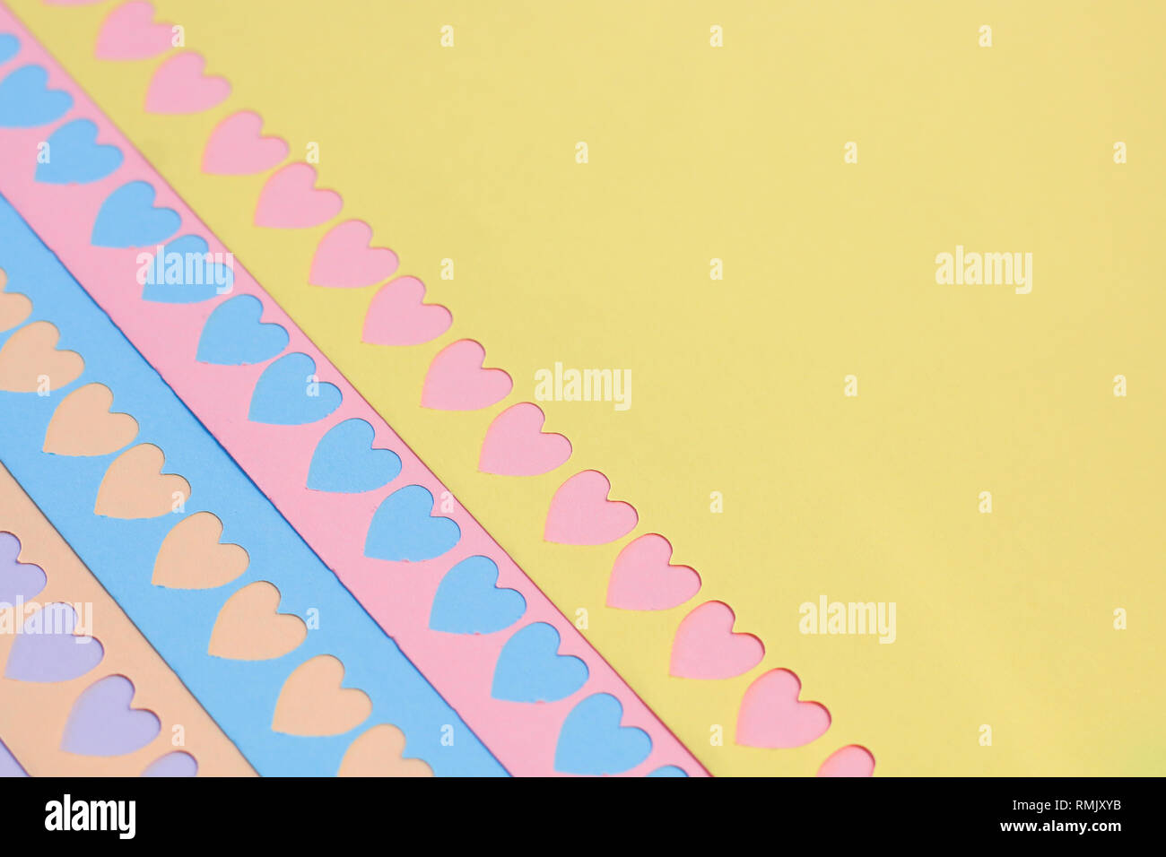 Colorful background with cutout hearts Stock Photo - Alamy