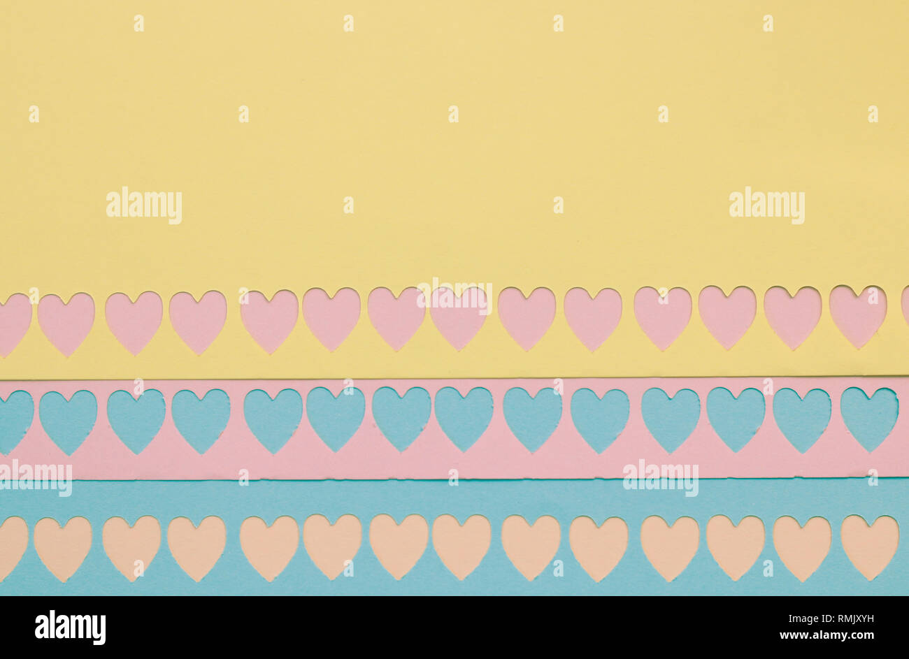 Colorful background with cutout hearts Stock Photo - Alamy