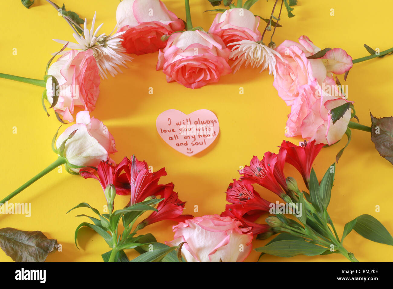 Flower arrangement with cute writing on a heart Stock Photo - Alamy