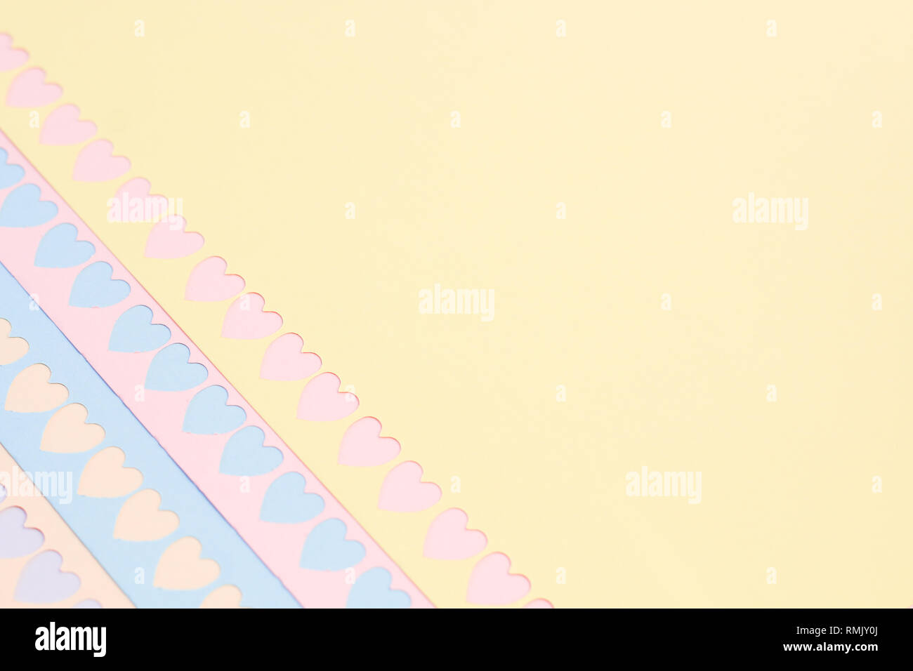 Colorful background with cutout hearts Stock Photo - Alamy