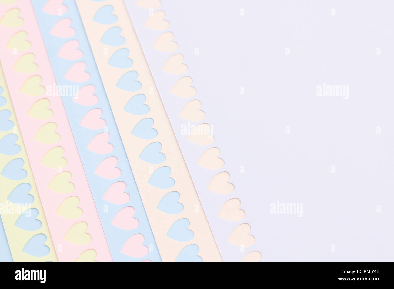 Colorful background with cutout hearts Stock Photo - Alamy