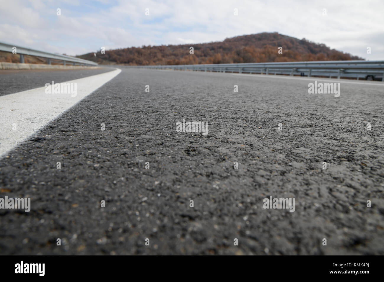 Asphalt road texture with white reflecting line. New road, surface a ...