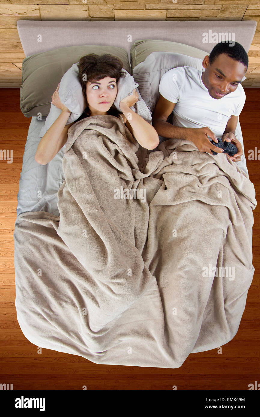 Tired female gamer playing video games hi-res stock photography and ...